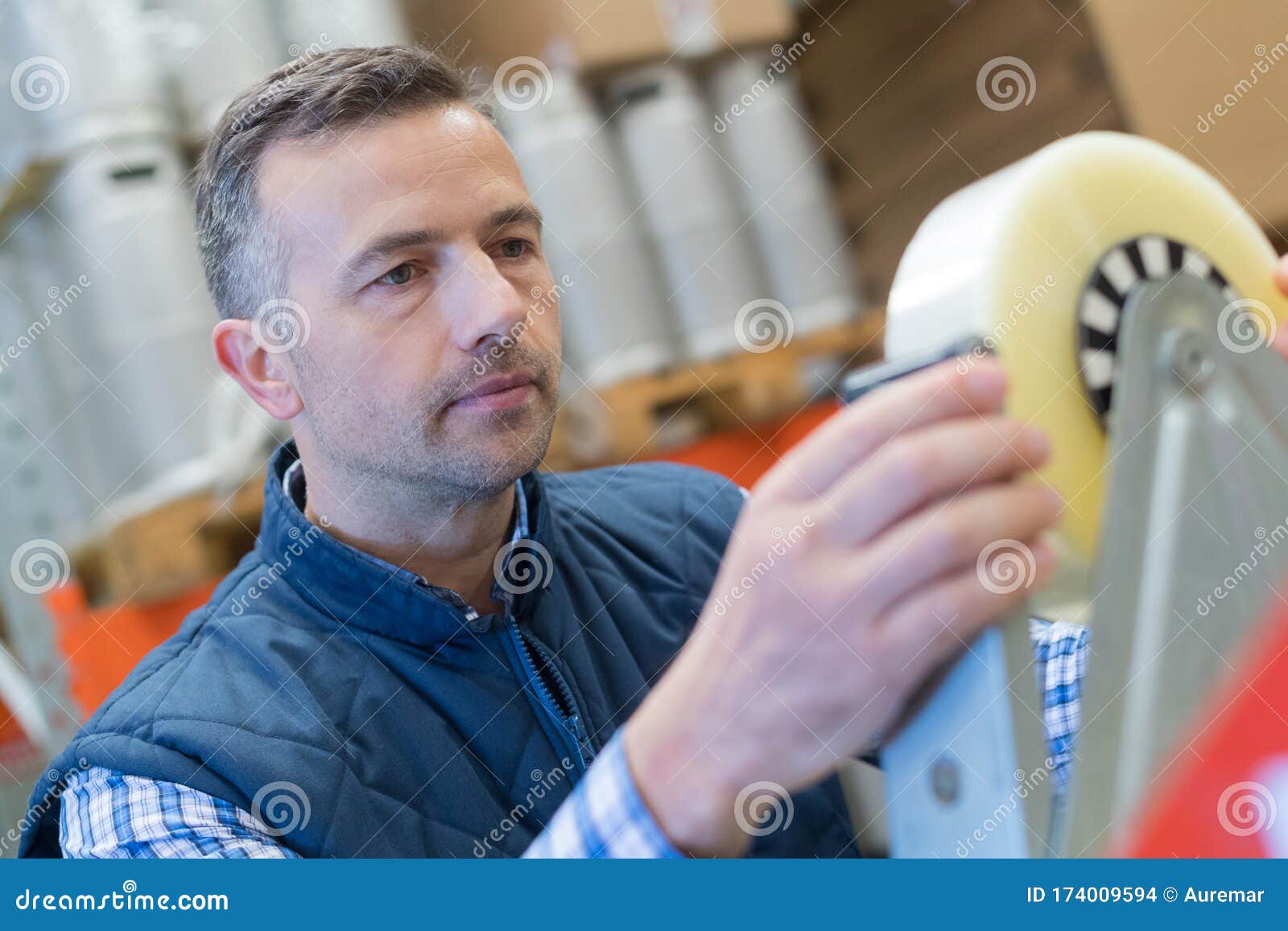 Man fixing trolley wheel stock photo. Image of assembler - 174009594