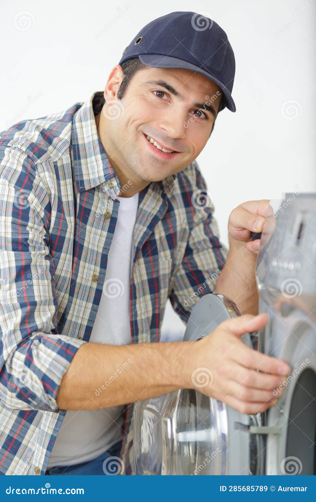 Man fixing washing machine stock image. Image of power - 285685789