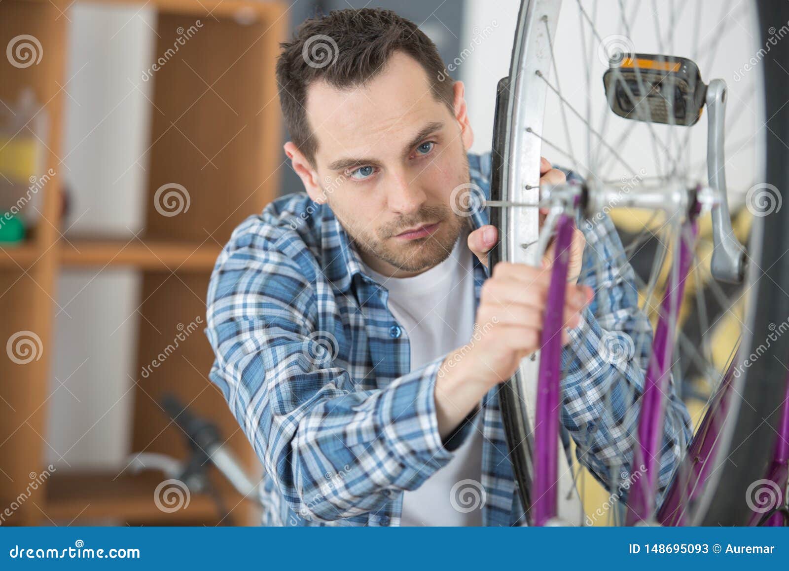 Man Fixing Wheel on Bicycle Stock Image - Image of equipment ...