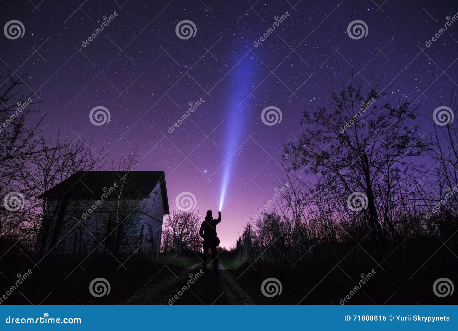 Man with Flashlight Near the House and Stars on Dark Sky Stock Photo ...