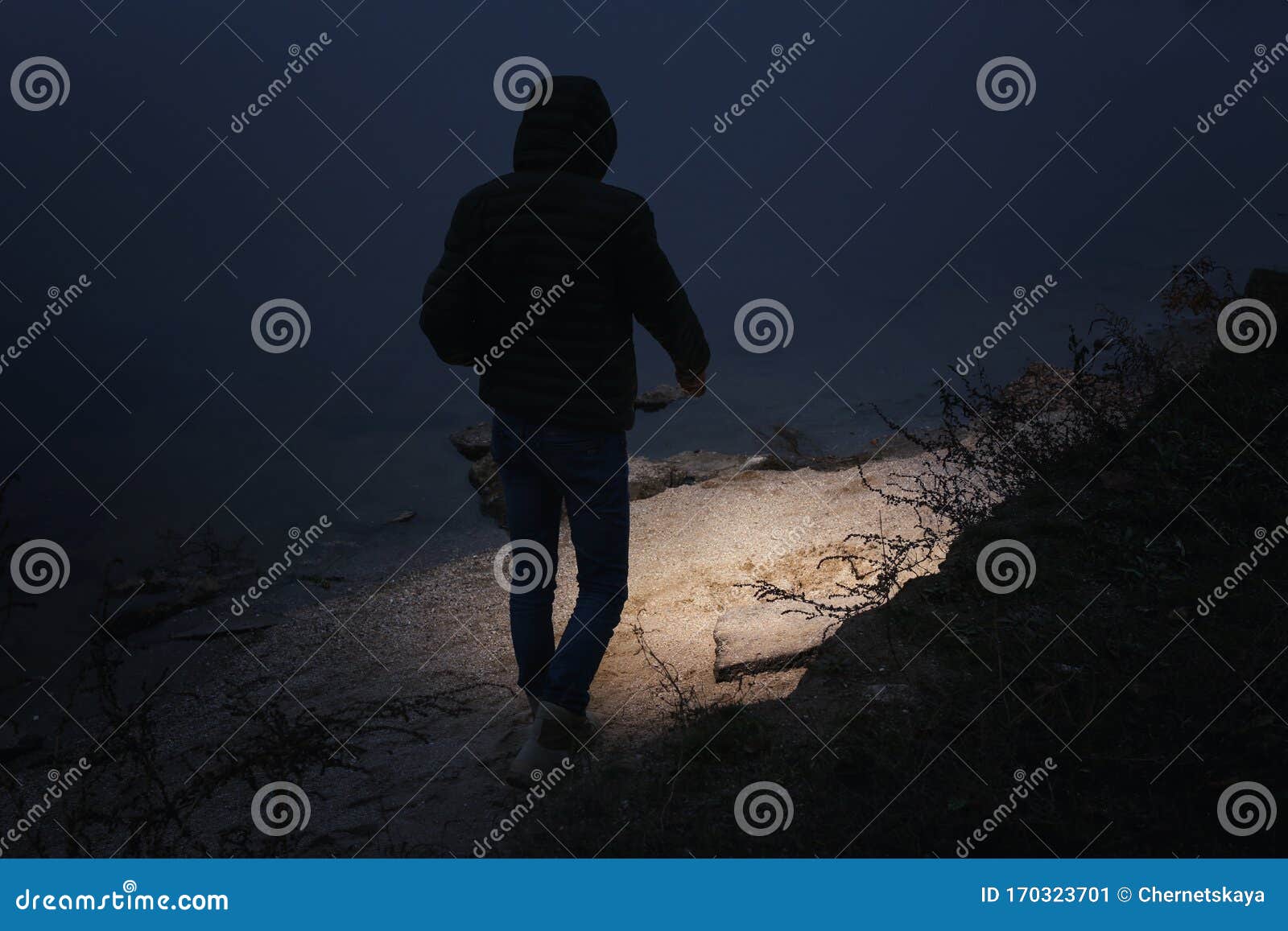 Man with Flashlight Walking Near River Stock Image - Image of hike ...