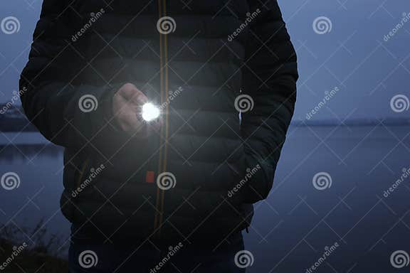 Man with Flashlight Walking Outdoors, Closeup Stock Image - Image of ...