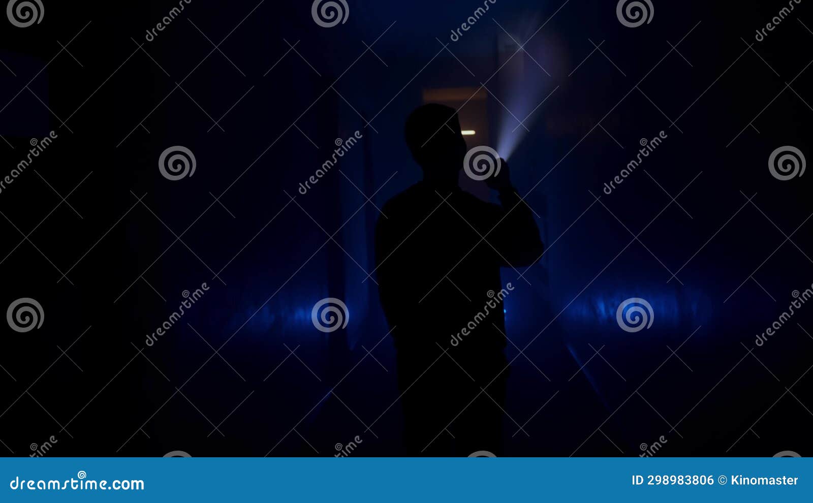 Man with a Flashlight Walks Along a Dark Corridor. Back View Stock ...
