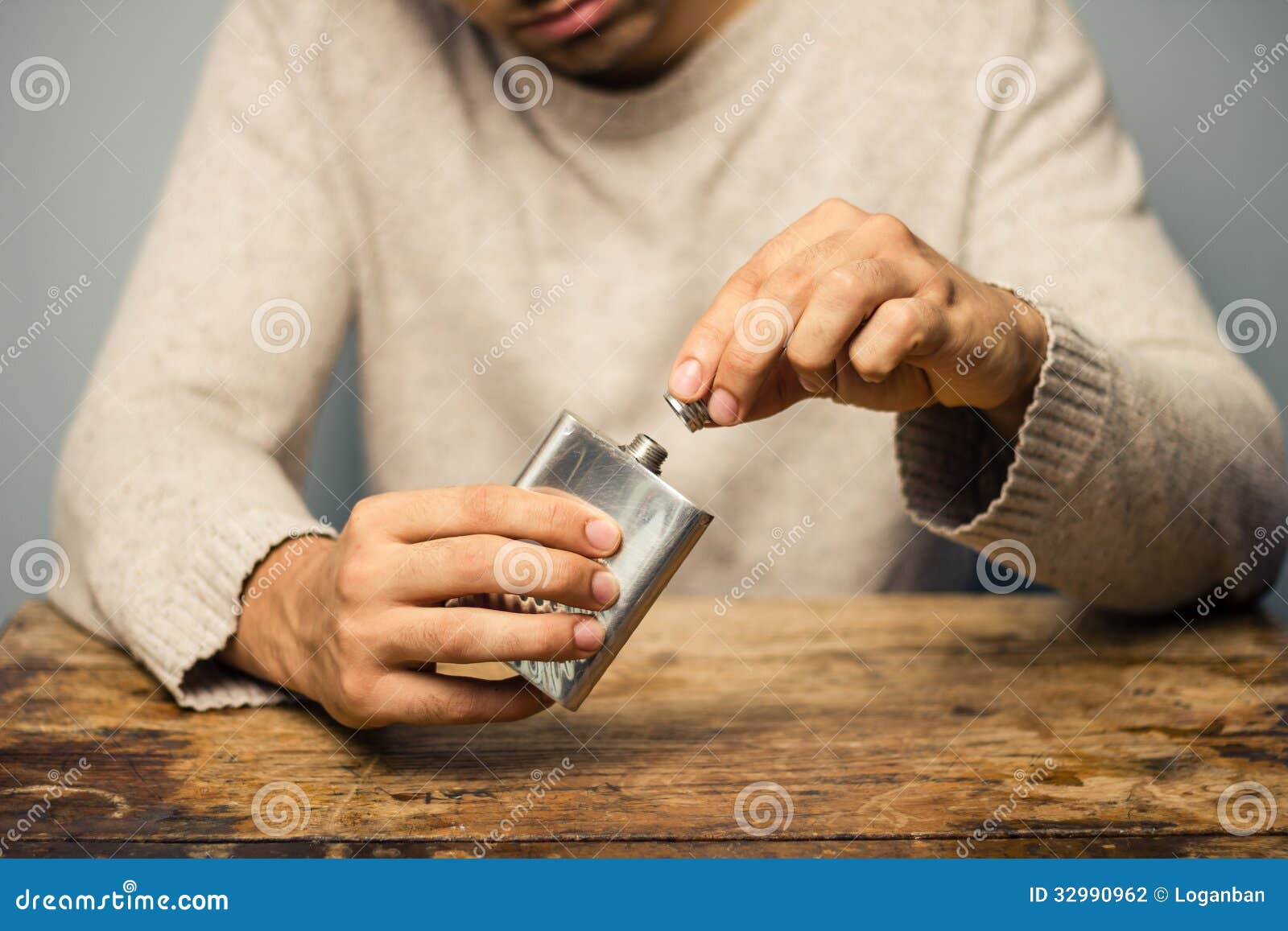 Man with flask at table stock photo. Image of foreground - 32990962