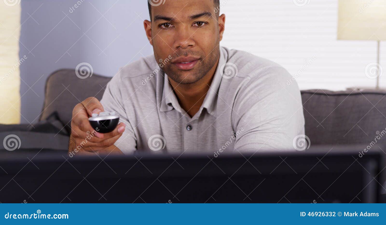 Man Flipping through Channels on TV Stock Photo - Image of home ...