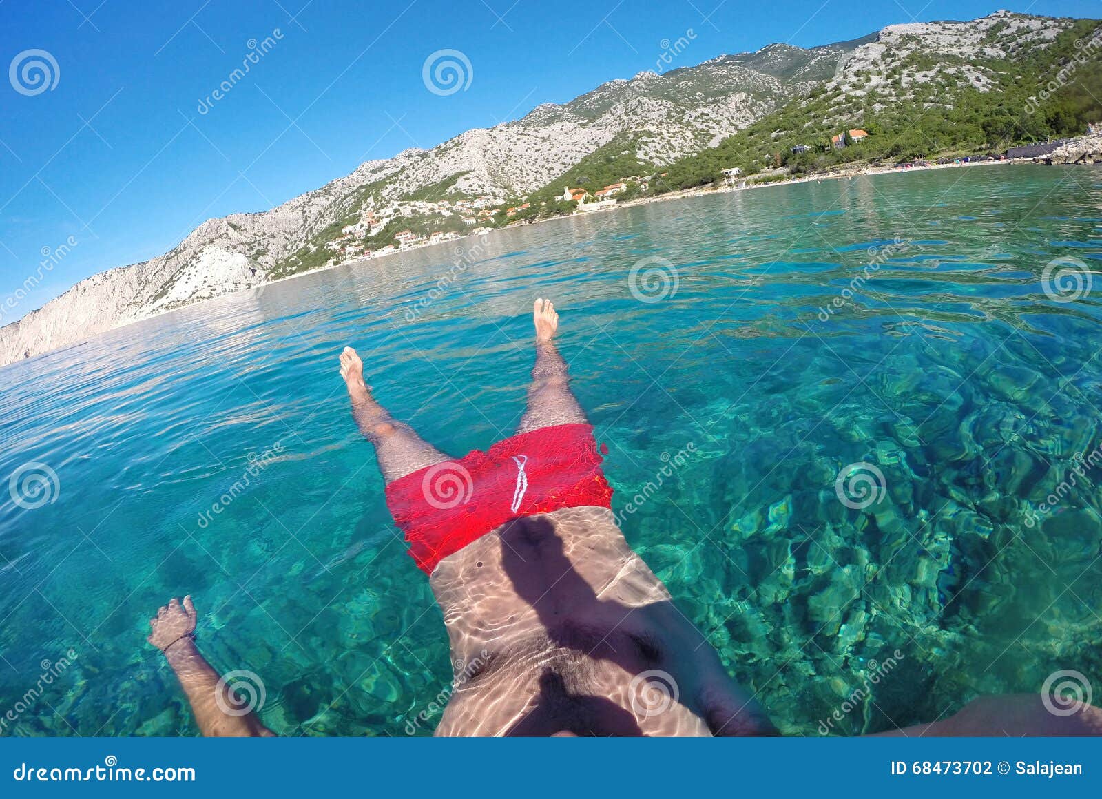 Man floating in sea water stock photo. Image of diving - 68473702