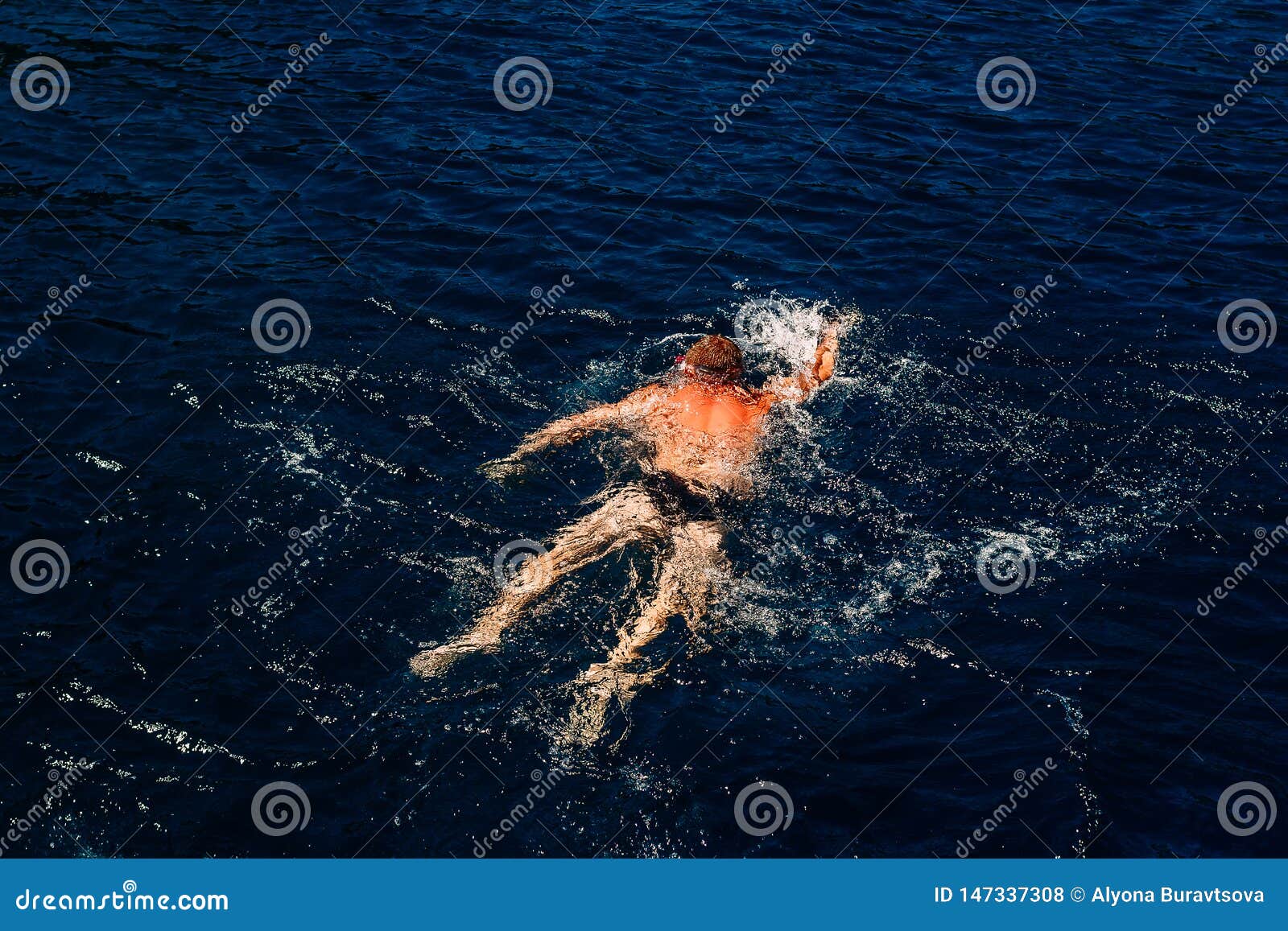 Man floats by sea stock photo. Image of activity, paradise - 147337308