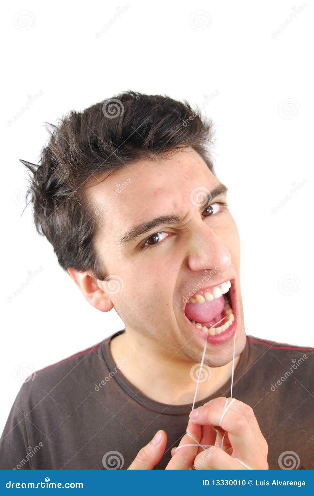 Man flossing his teeth stock photo. Image of person, health - 13330010