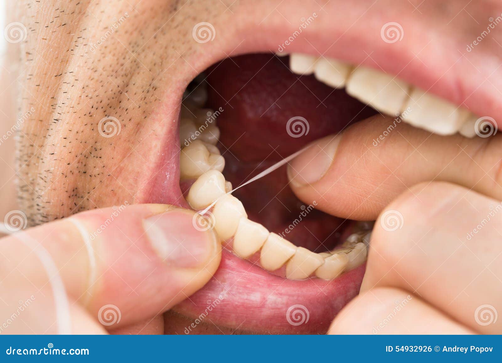 Man flossing teeth stock photo. Image of flossing, mouth - 54932926