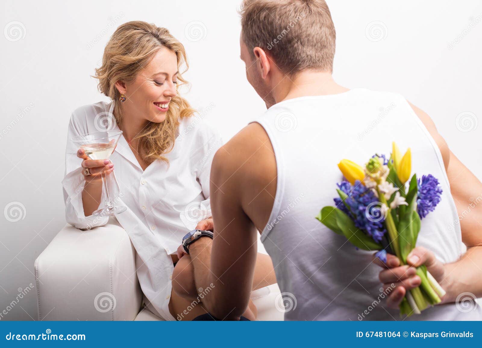 Man with Flowers Behind His Back Surprising Woman Stock Photo - Image ...
