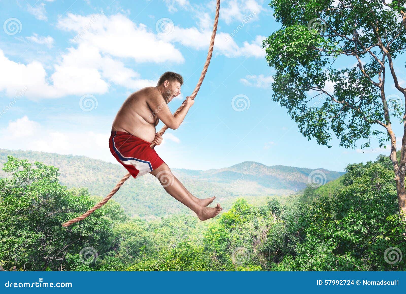 Man Flying in the Air by Rope Stock Photo - Image of danger, casual ...