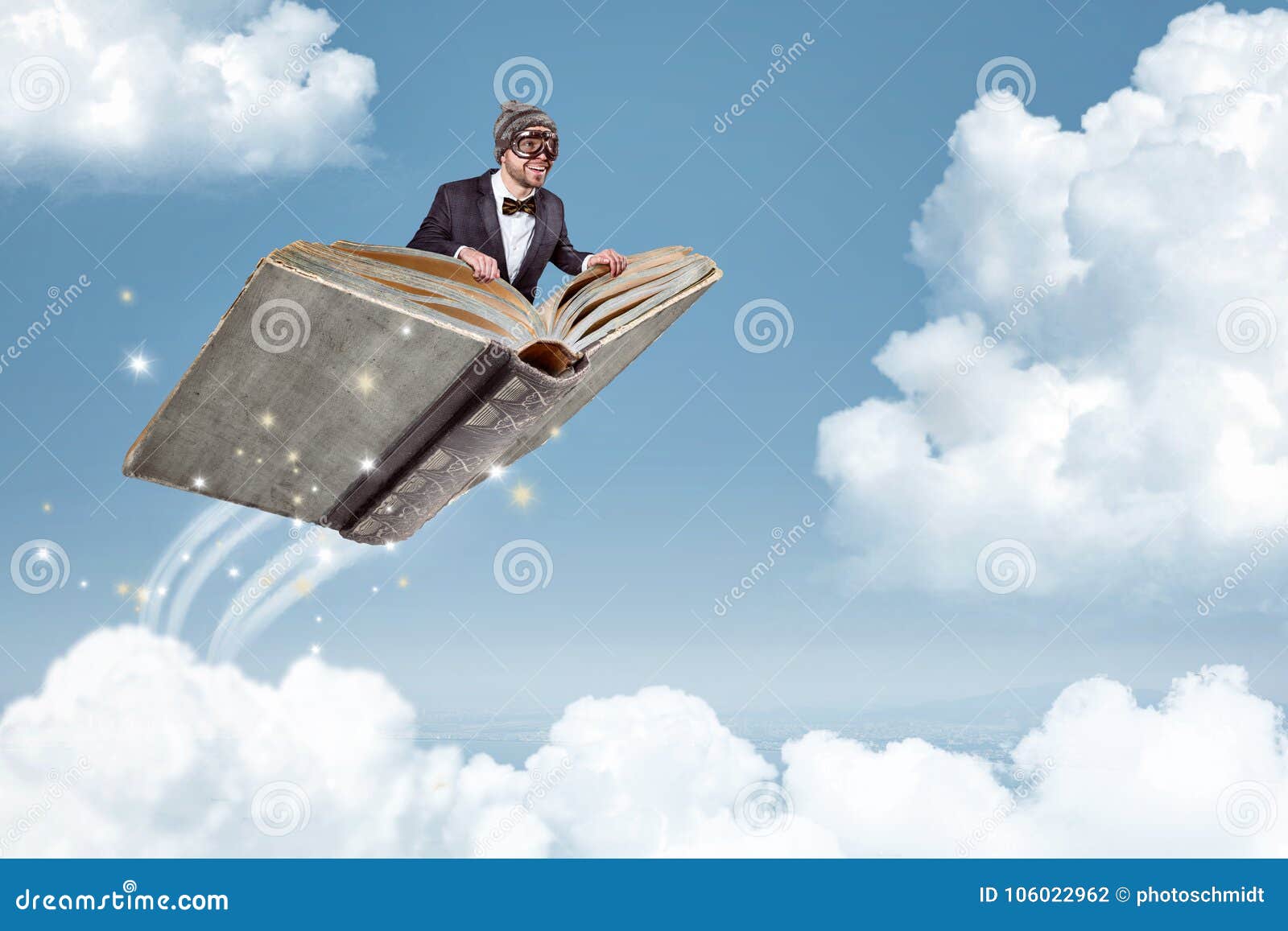 Man Flying on a Book Over the Clouds Stock Photo - Image of education ...