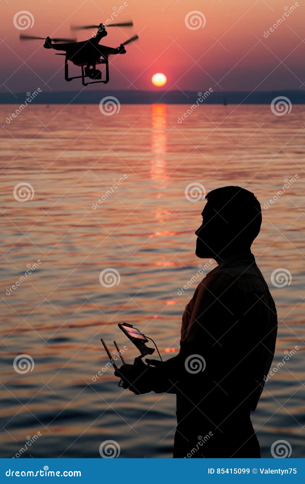 Man flying a drone. stock image. Image of sundown, digital - 85415099