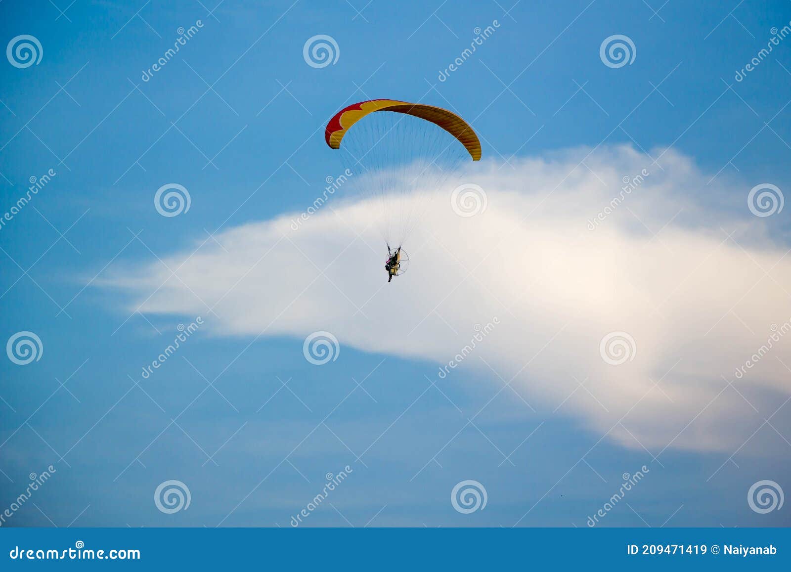 Man Flying with Paramotor Engine Glider Parachute on Beautiful Blue Sky ...