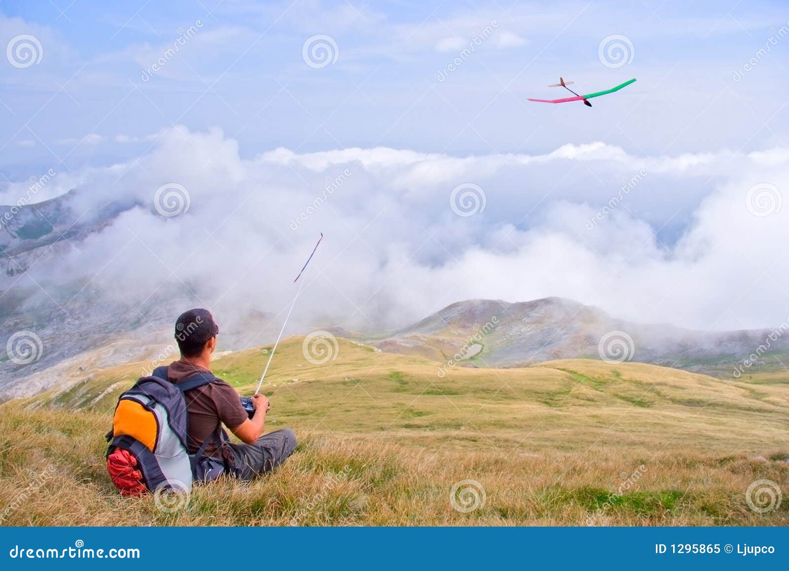 Man Flying a Plane from a Top of the Mountain Stock Image - Image of ...