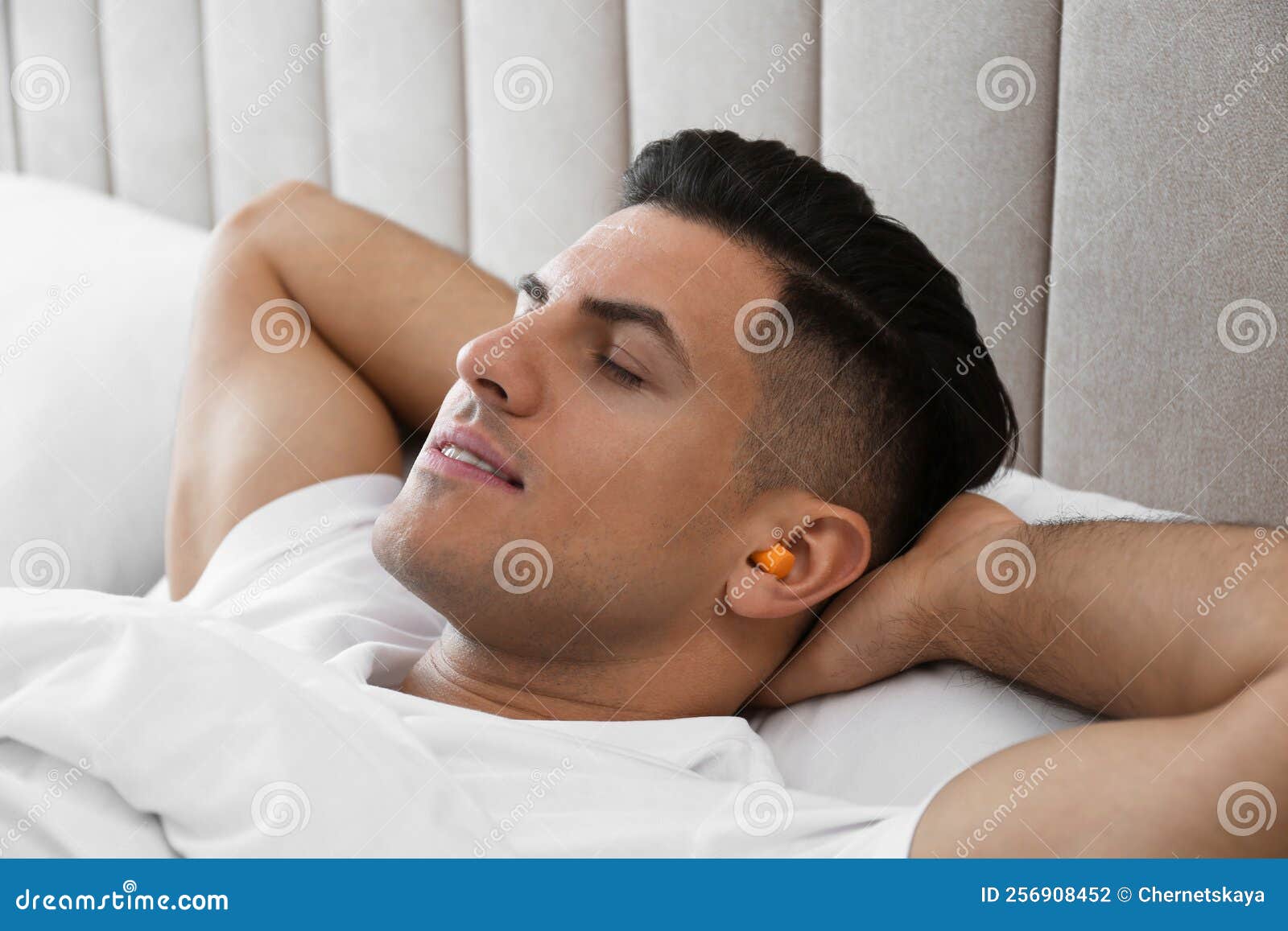 Man with Foam Ear Plugs Sleeping in Bed Stock Photo - Image of pillow ...