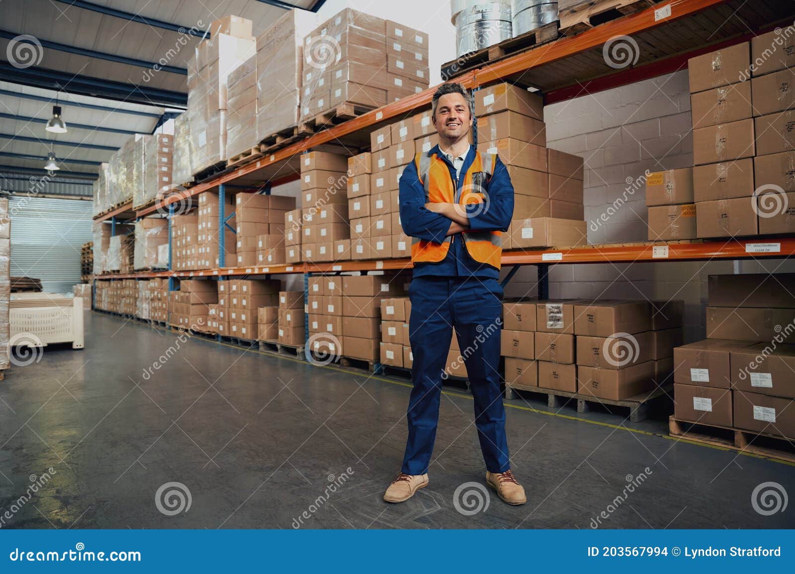 Full Length View of a Man with Folded Hands Standing in the Factory ...