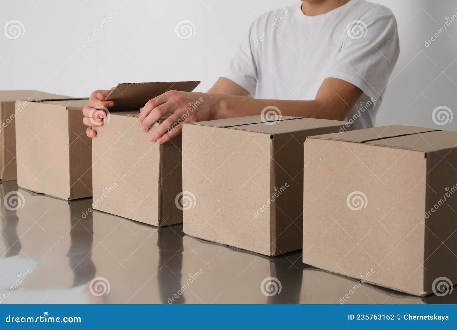 Folding Cardboard Boxes. Perforated Sheets Of Corrugated Cardboard Are ...