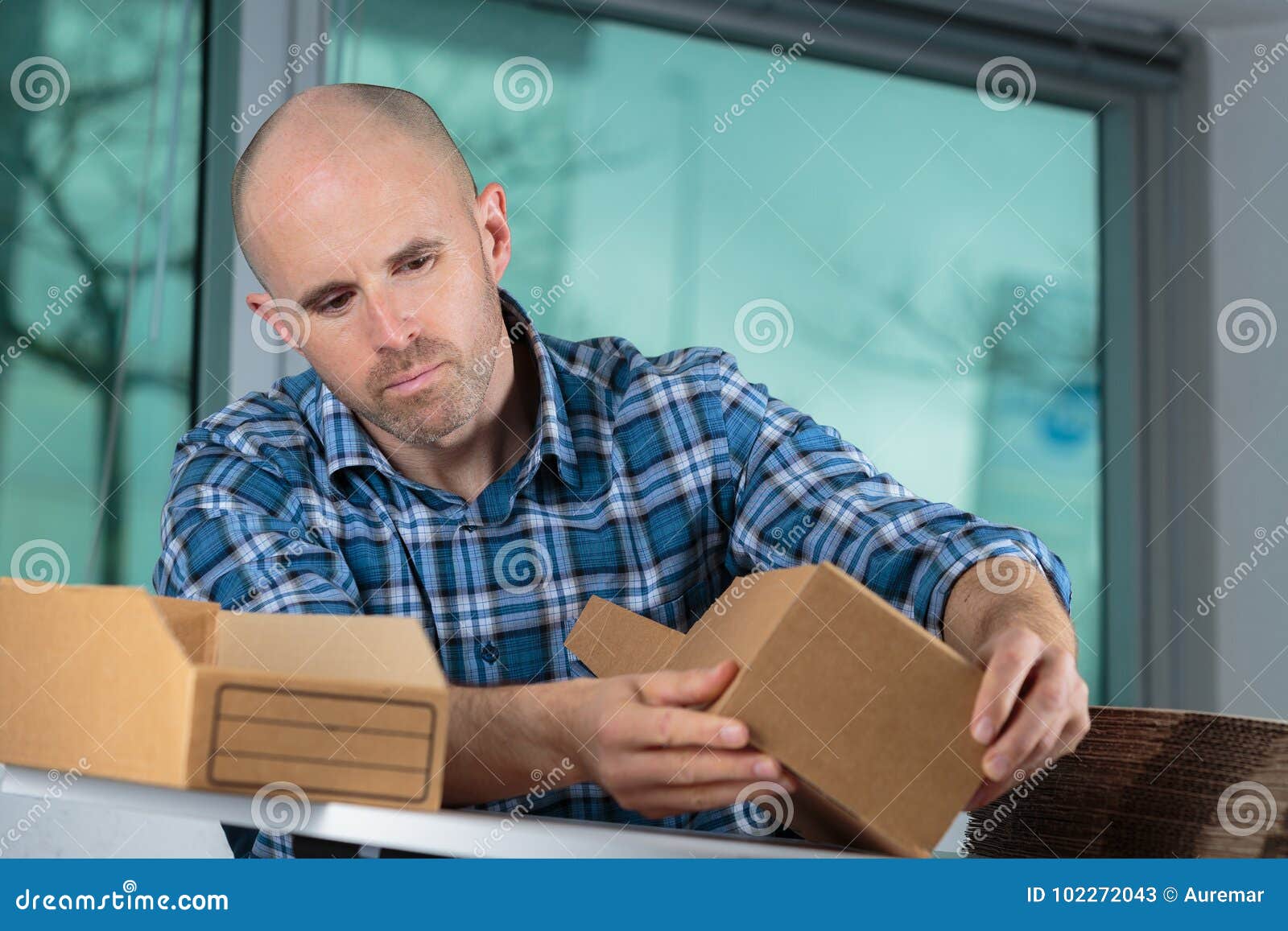 Man folding cardboard box stock image. Image of shipping - 102272043