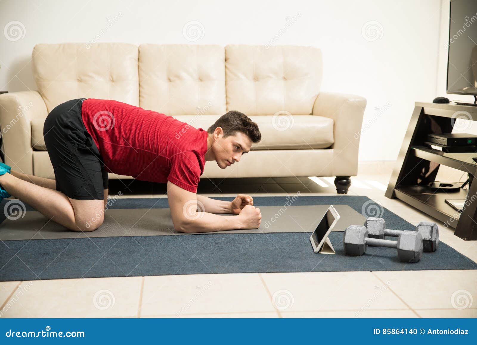 Man Following Training Routine on a Tablet Stock Photo - Image of ...