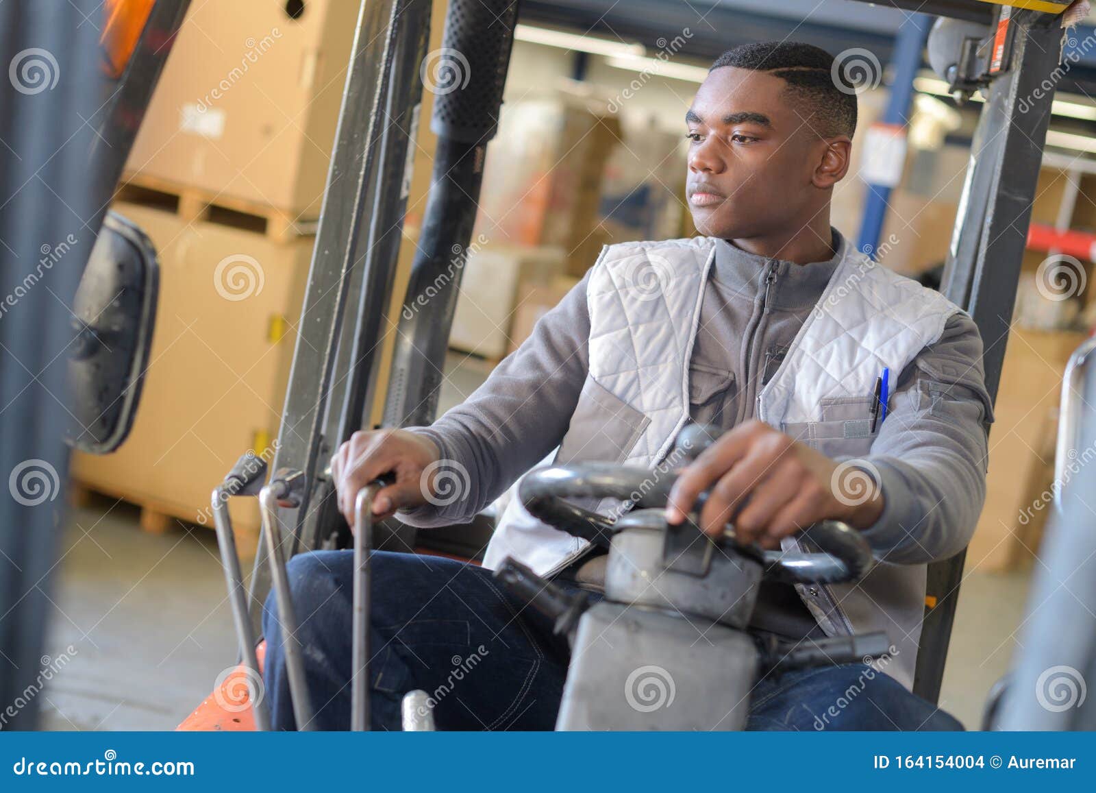 Man on Forklift Loader Loading Boxes at Warehouse Stock Photo - Image ...