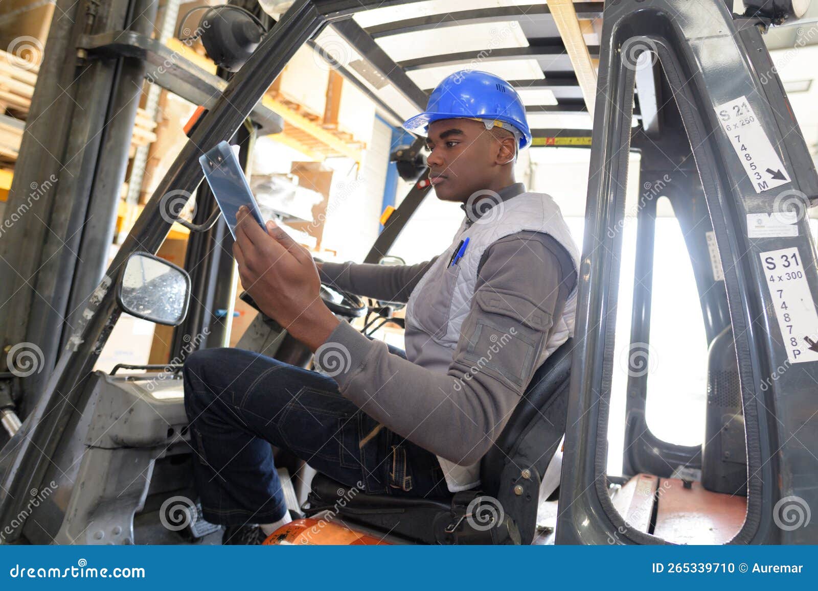 Man on Forklift Loading Boxes at Warehouse Stock Photo - Image of ...