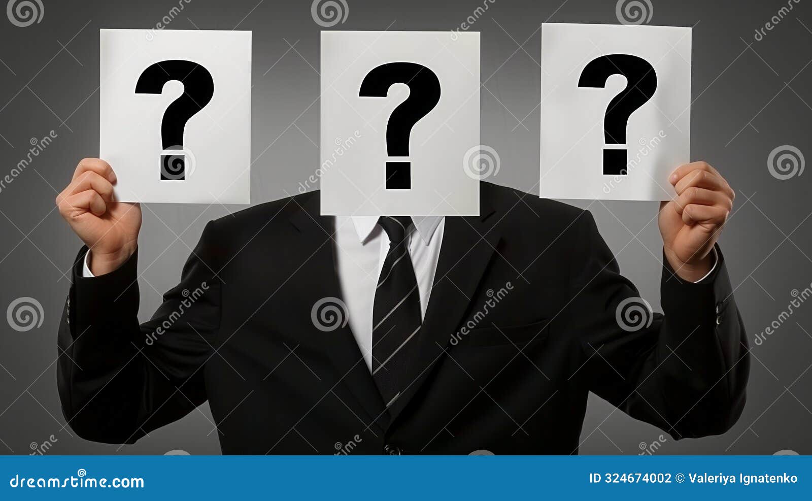 Man in Formal Wear Standing with Three Question Marks Signs Covering ...