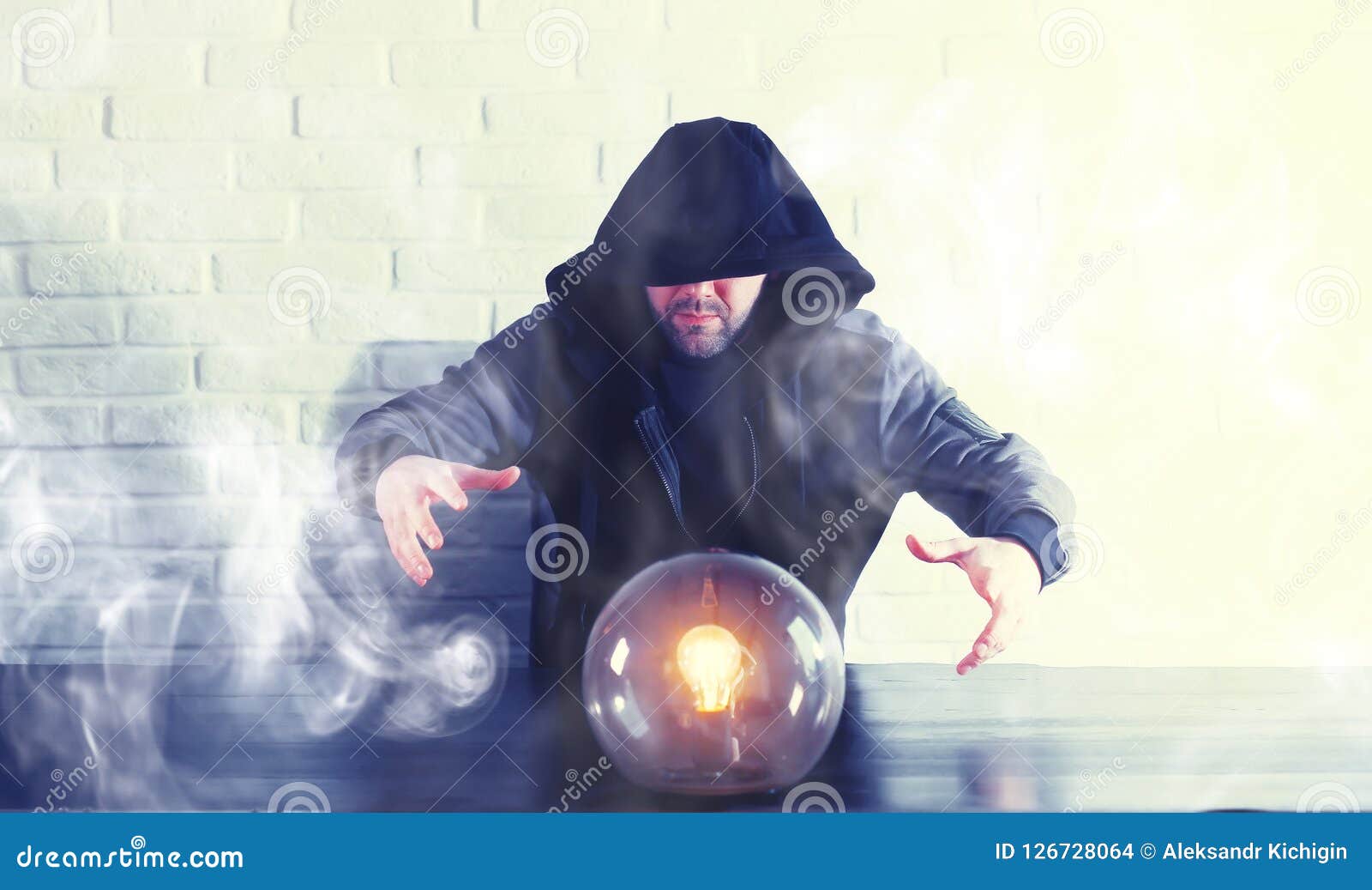 A Man with a Fortune Teller Ball Stock Photo - Image of hands, hand ...