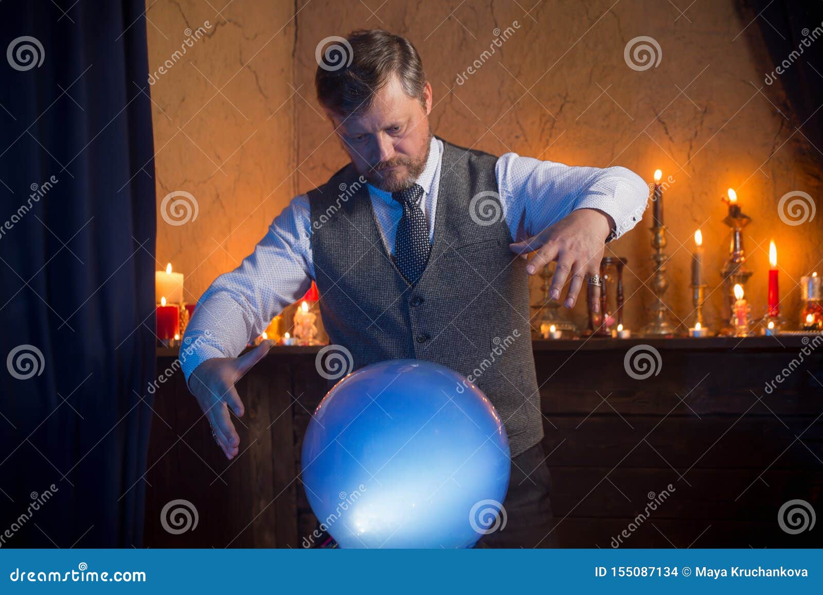 Man Fortune Teller with Illuminated Crystal Ball Stock Photo - Image of ...