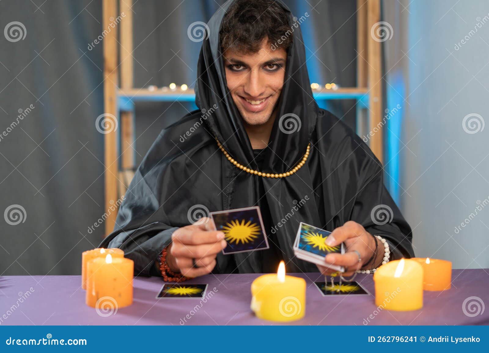 Man Fortune Teller Reading the Future by Tarot Cards Sitting at a Table ...