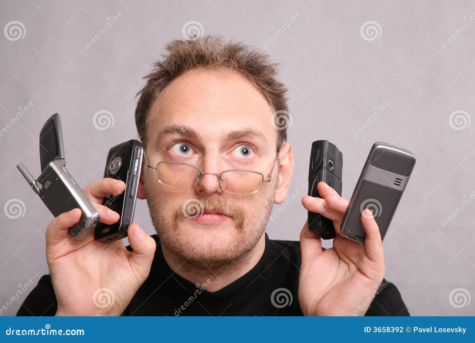 Man with four cell phones stock photo. Image of happiness - 3658392