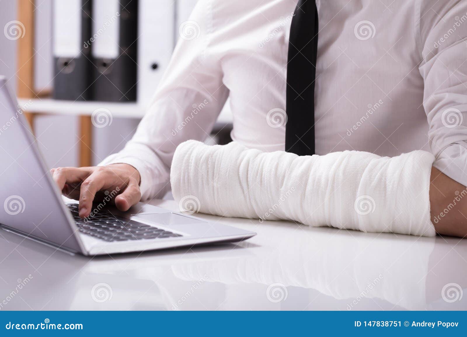 Man with Fractured Hand Using Laptop Stock Image - Image of handicapped ...