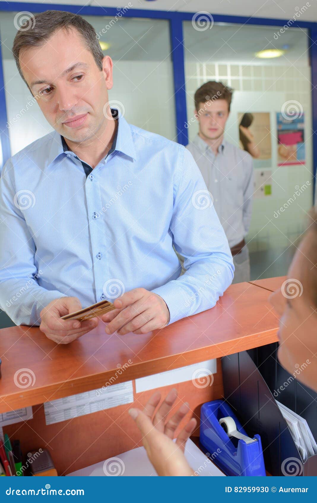 Man in front desk stock photo. Image of unacceptable - 82959930