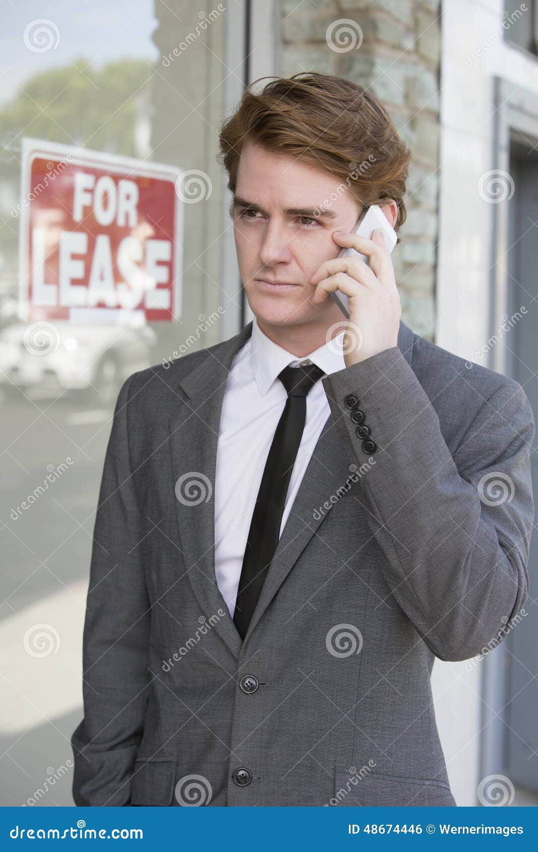 Man in Front of a Store on the Phone Stock Photo - Image of housing ...