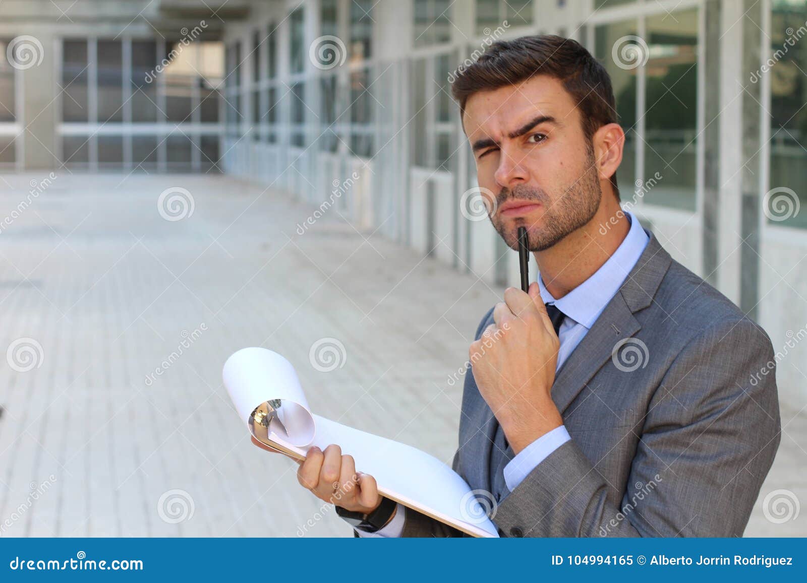 Man Frowning while Taking Notes Stock Image - Image of holding, elegant ...