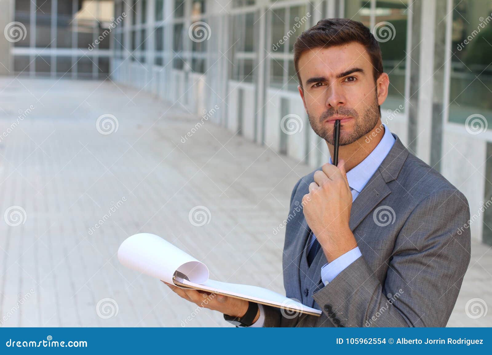 Man Frowning while Taking Notes Stock Photo - Image of agent, notes ...