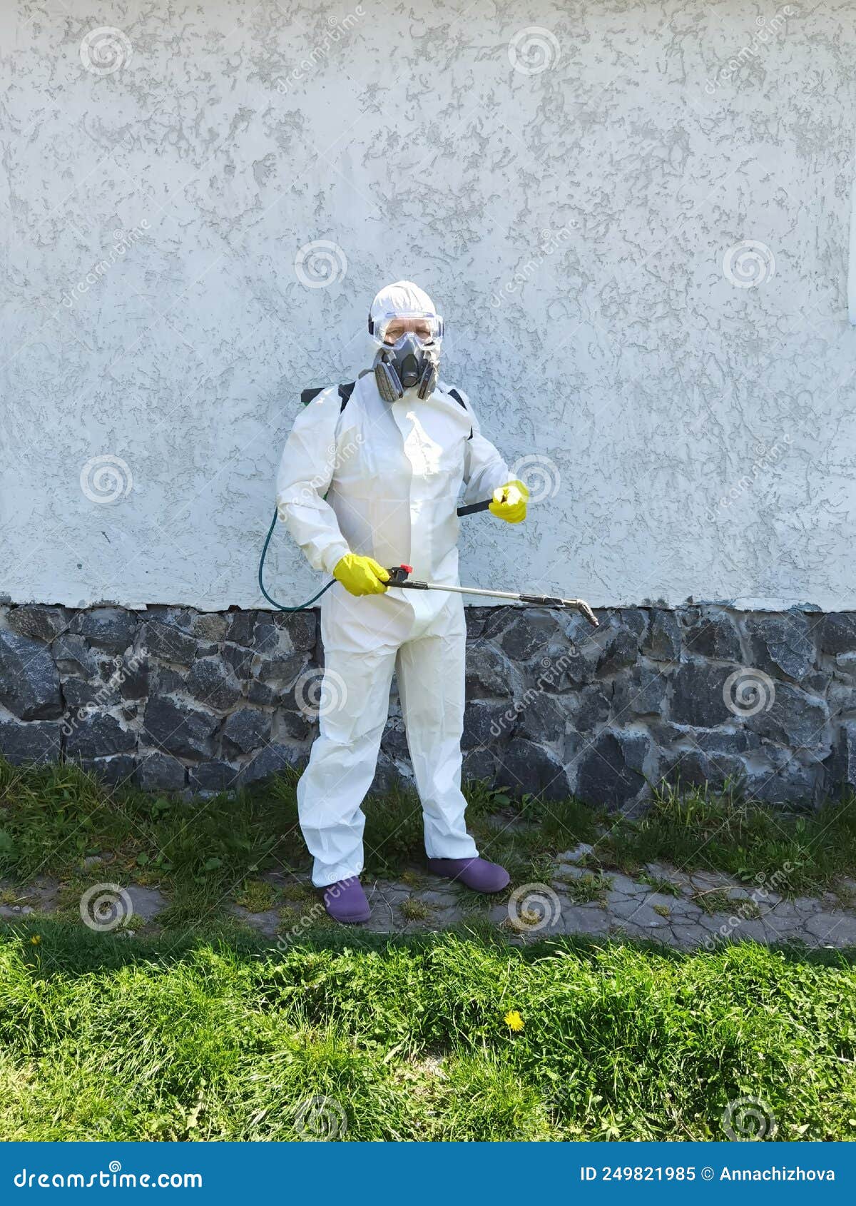 Man in Full Protective Clothing Using Pressure Washer. Stock Image ...