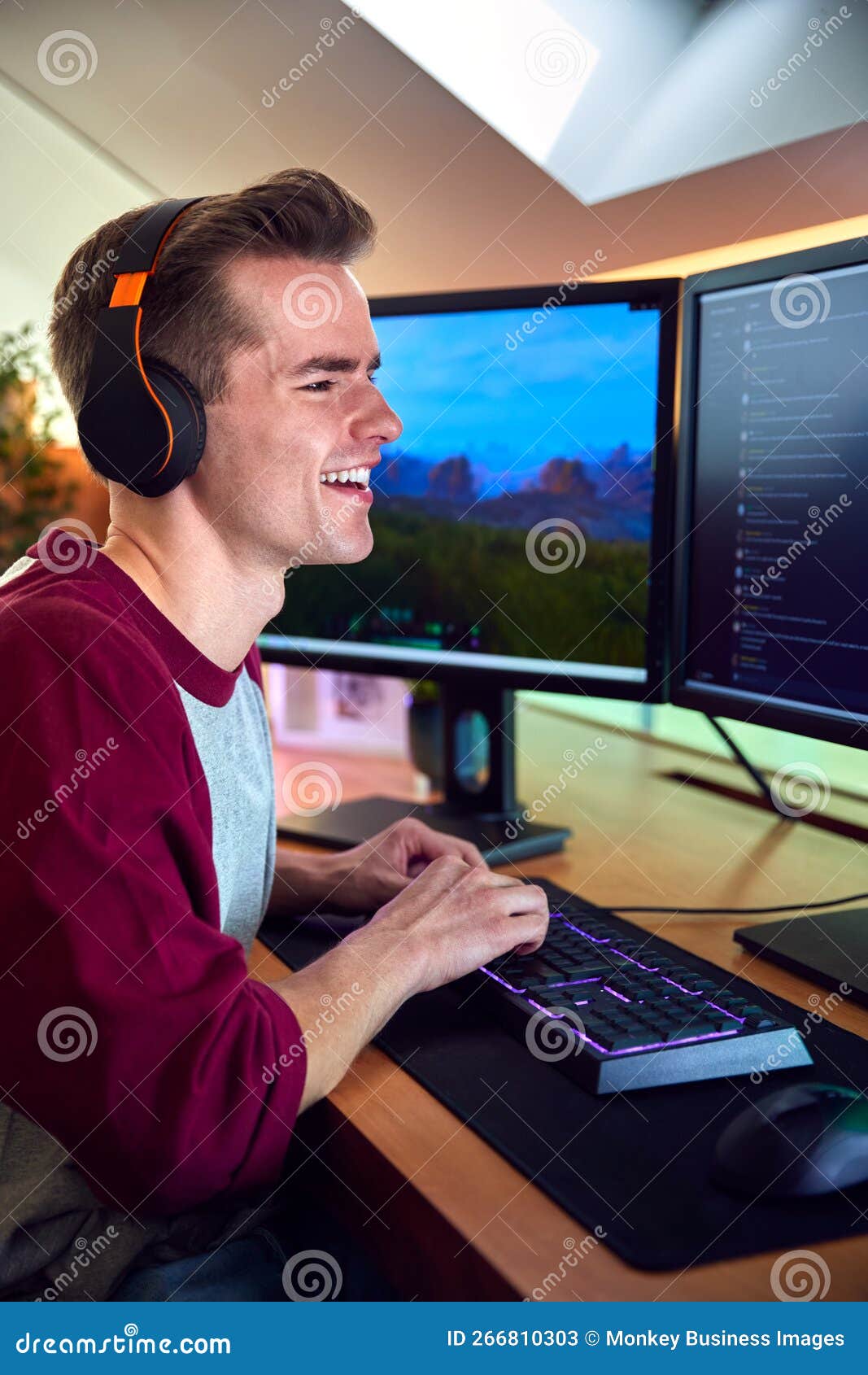 Man Gaming at Home Sitting at Desk with Multiple Monitors Stock Image ...