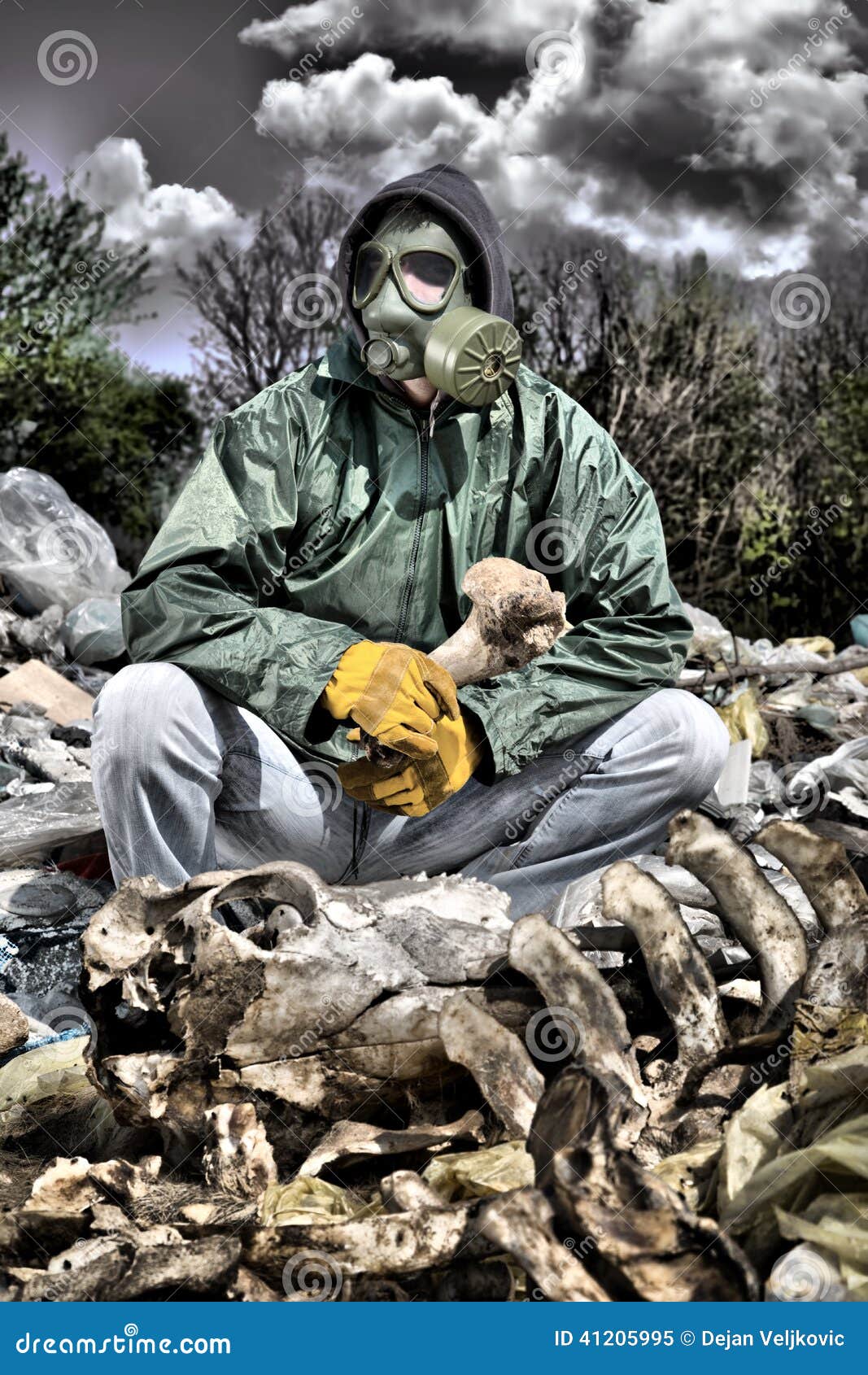 Man in a Gas Mask Sitting on the Garbage and Holding a Bone Stock Image ...