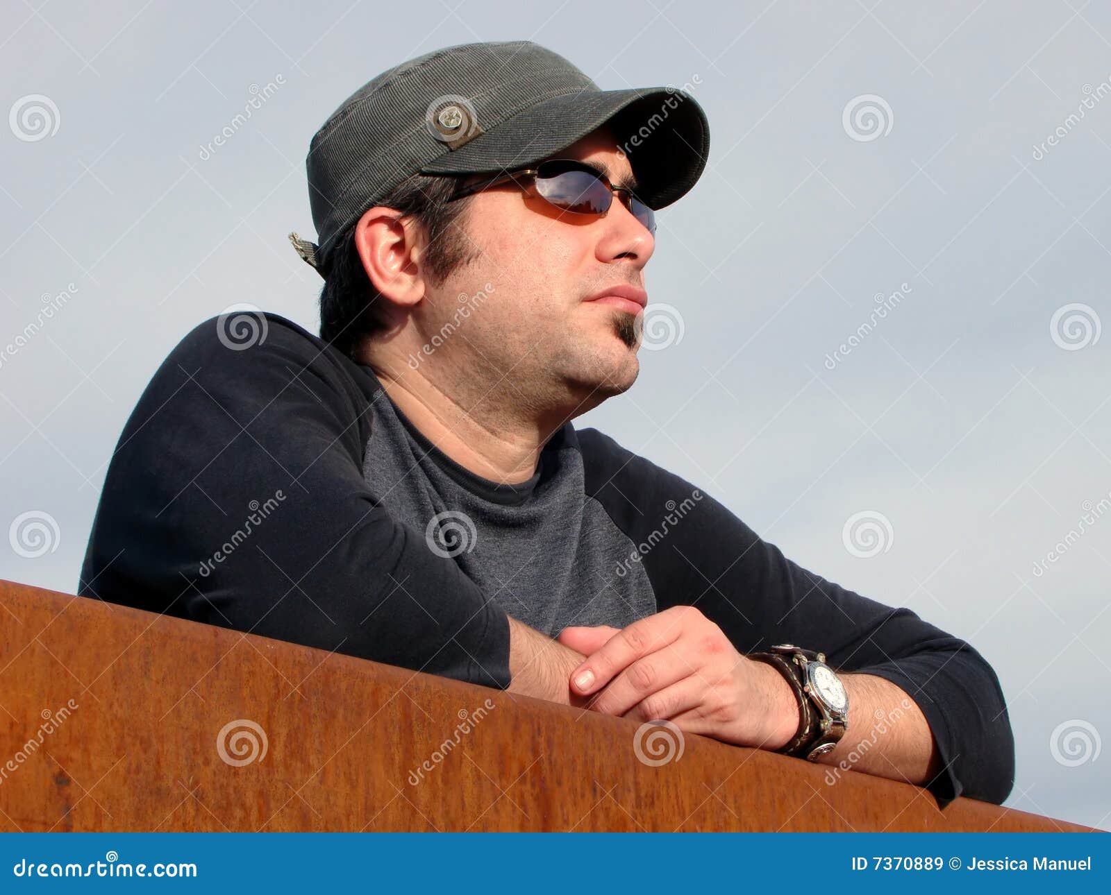 Man Gazing from Bridge stock image. Image of contemplating - 7370889