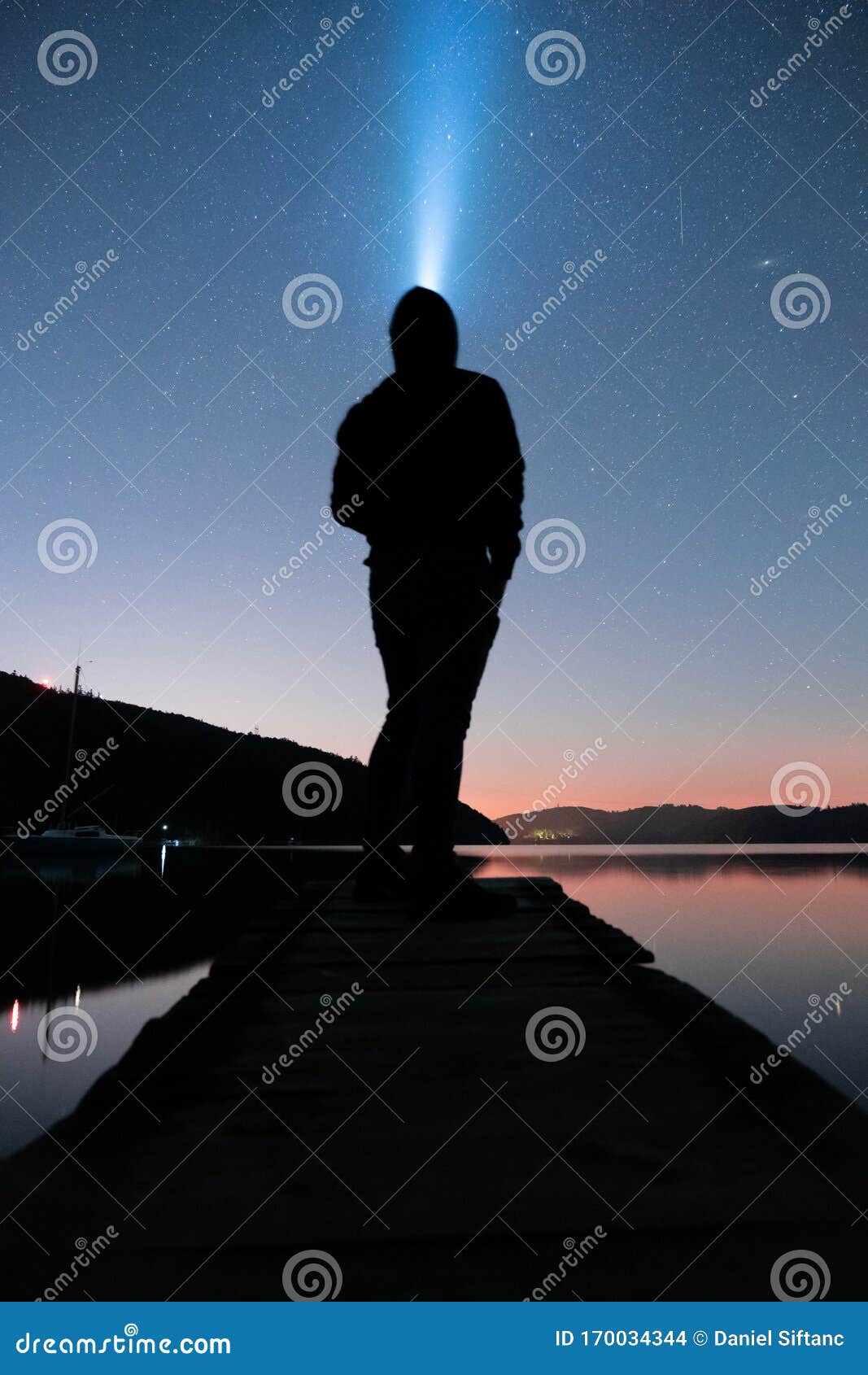 Man Gazing Over the Night Sky with the Flashlight Stock Photo - Image ...