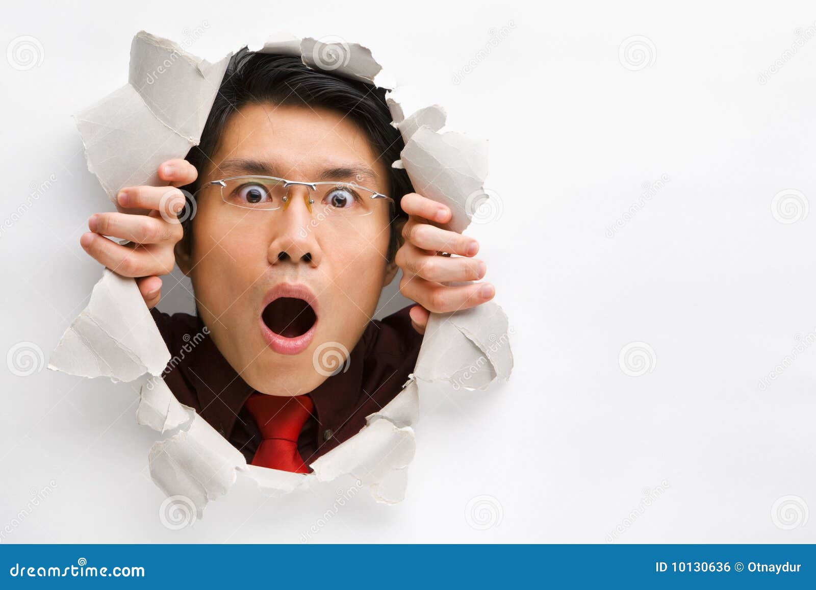 Man Gazing Surprisingly from Hole in Wall Stock Photo - Image of young ...