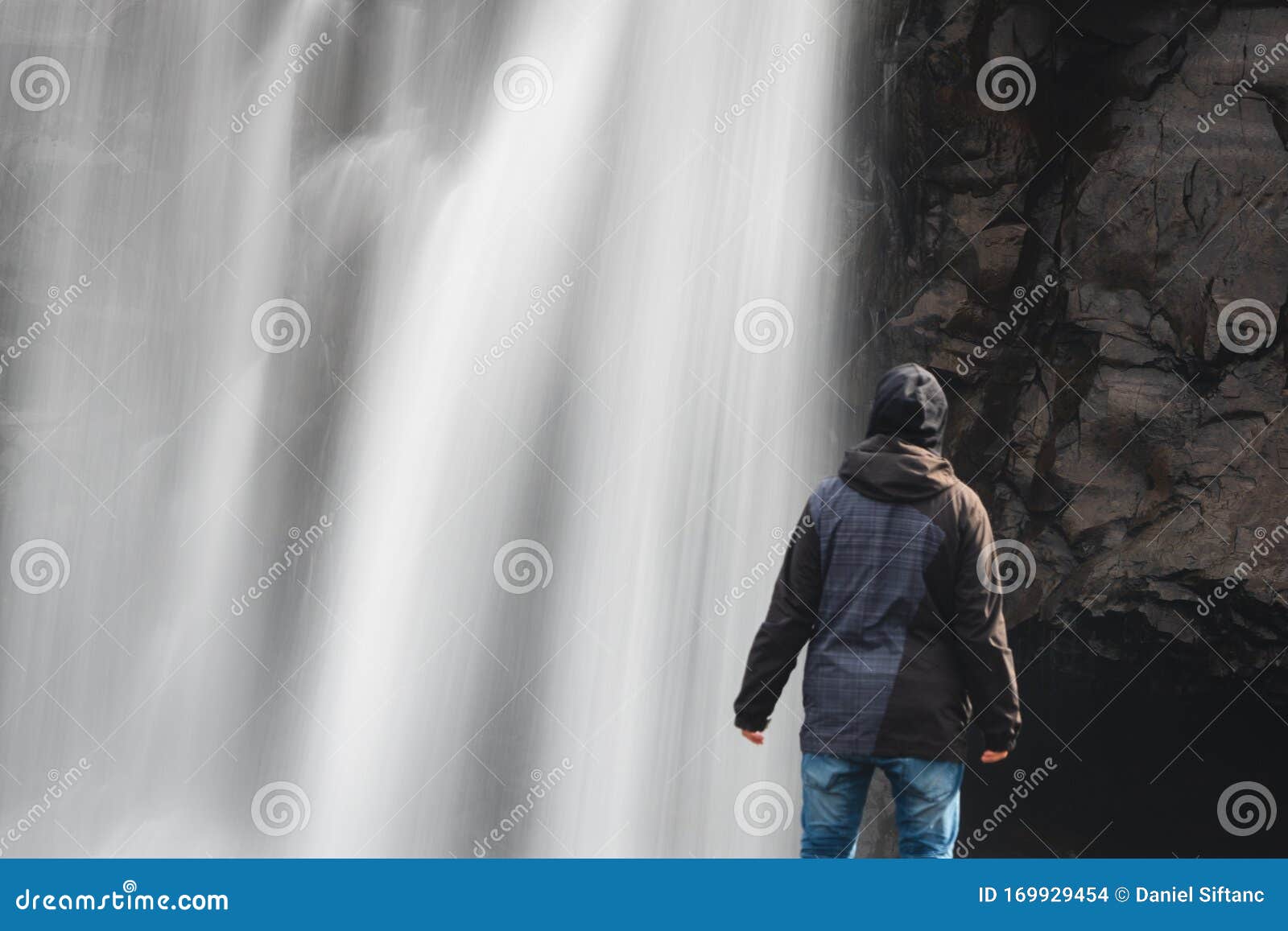 Man Gazing at the Waterfall Stock Photo - Image of rock, fall: 169929454