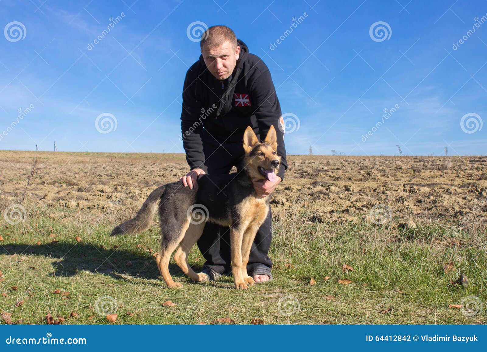 Man with a German shepherd stock photo. Image of people - 64412842