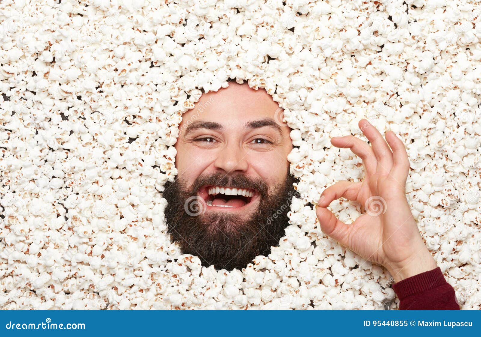Man gesturing in popcorn stock image. Image of approval - 95440855