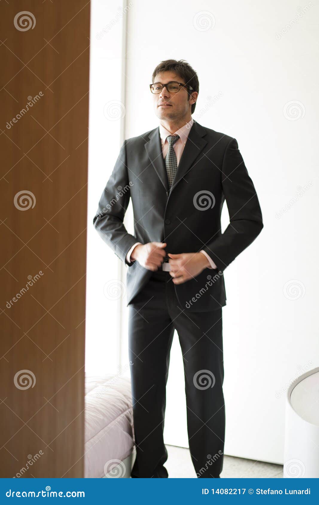 Man Getting Dressed in Hir Bedroom Stock Image - Image of formal, young ...