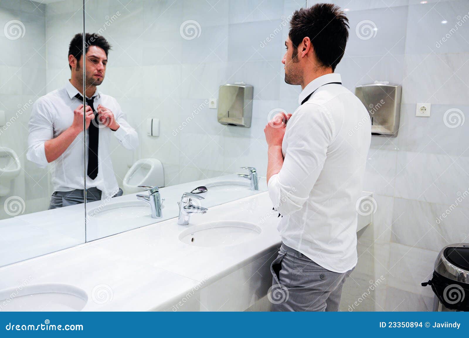 Man Getting Dressed in a Public Restroom Stock Photo - Image of ...