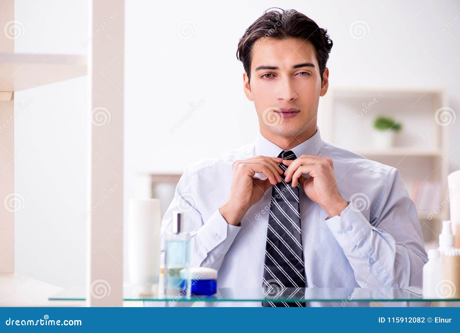 The Man is Getting Dressed Up for Work in Bathroom Stock Photo - Image ...