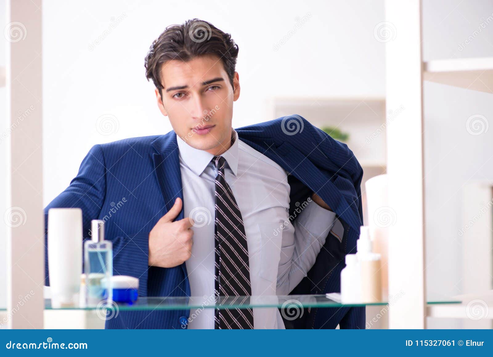 The Man is Getting Dressed Up for Work in Bathroom Stock Image - Image ...