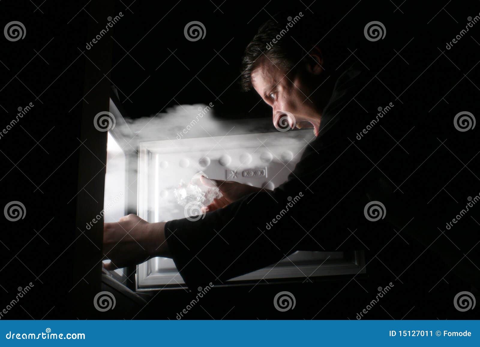 Man getting ice stock image. Image of freezer, cold, frozen - 15127011